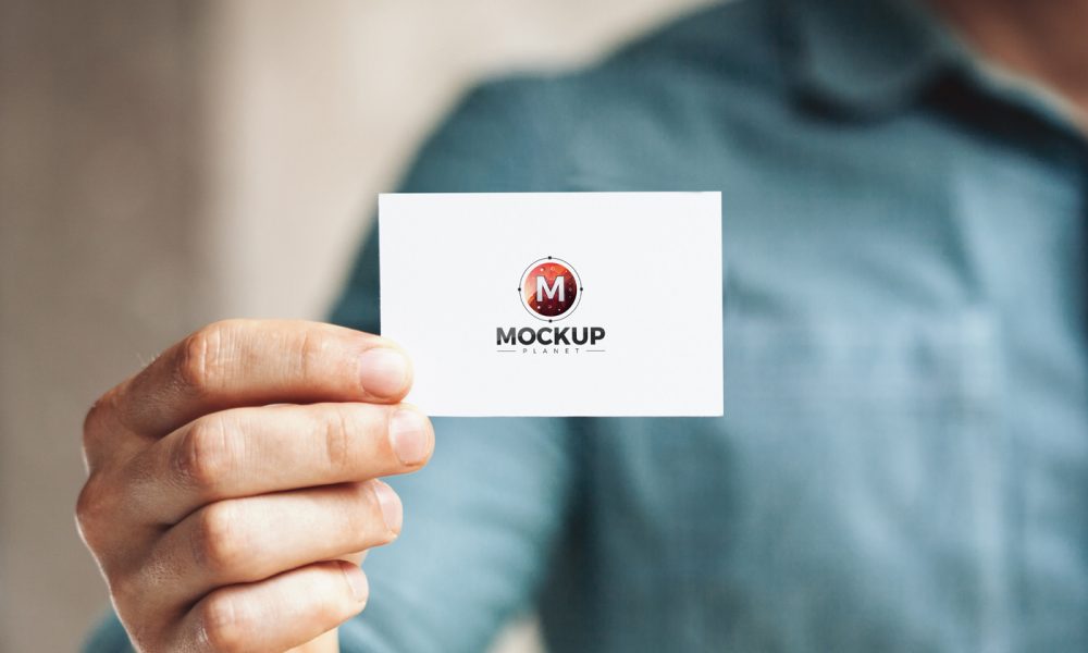 Free Man Holding in Hand Business Card Mockup PSD For Presentation ...